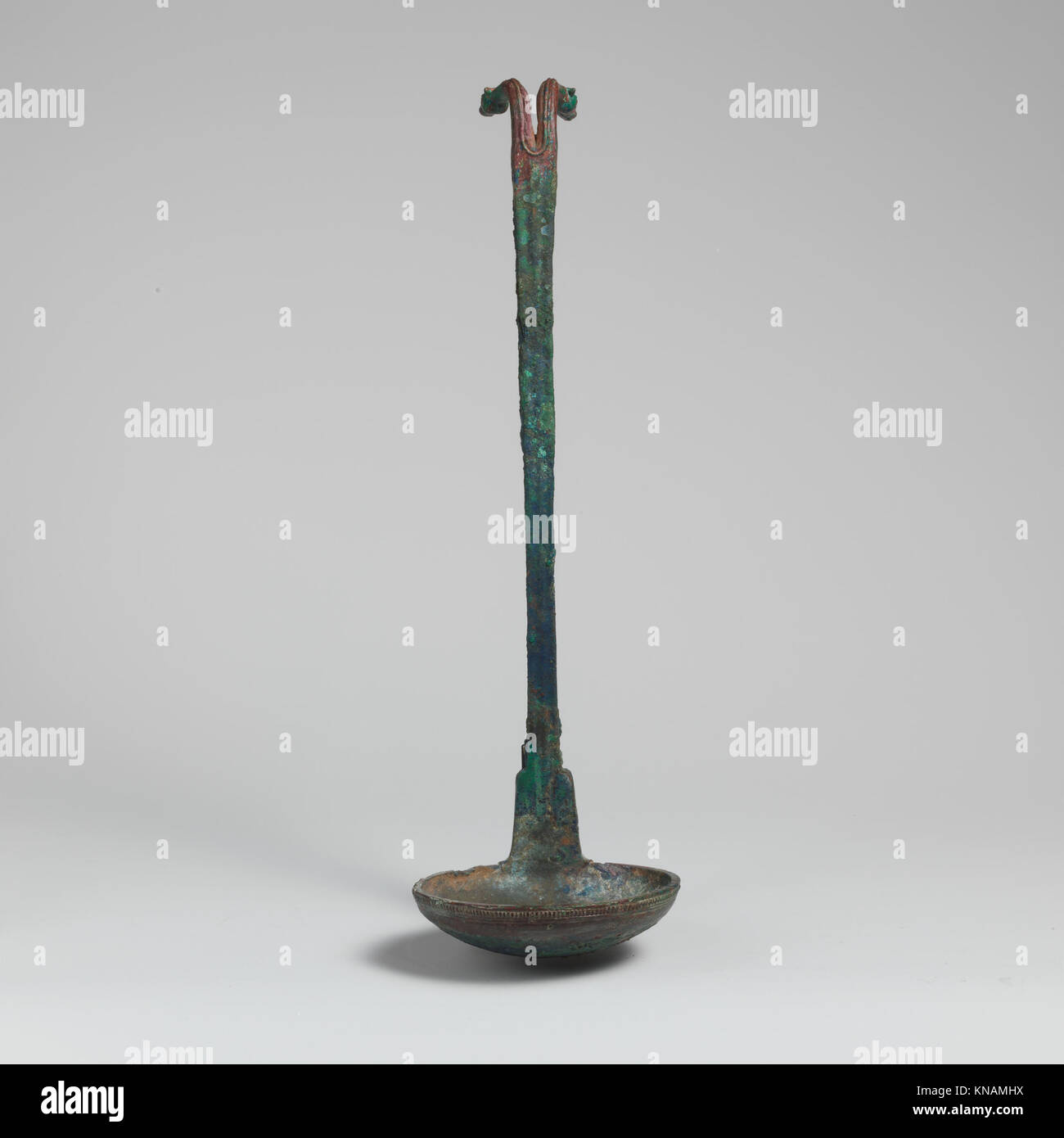 A bronze ladle cataloged under MET DP115825. This artifact exemplifies ...