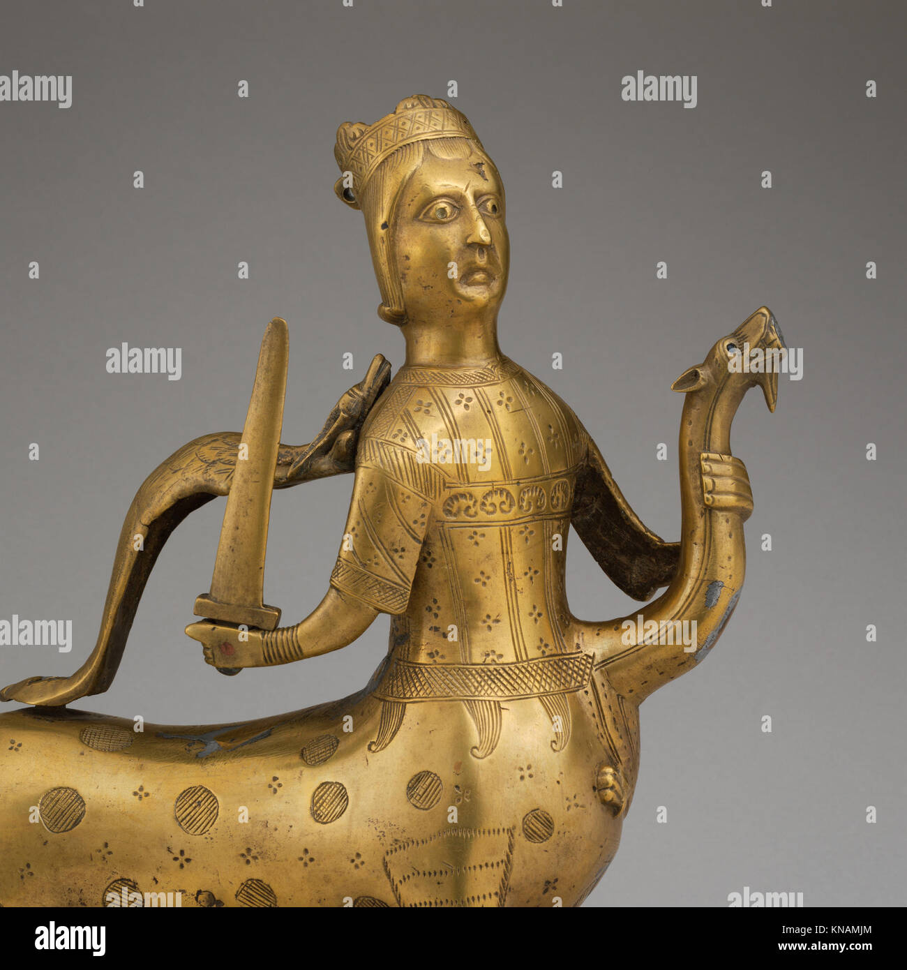 This medieval aquamanile, shaped as a crowned centaur fighting a dragon ...