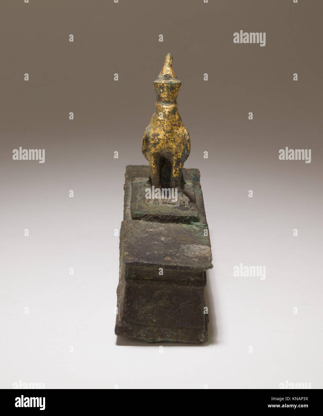 Falcon in double crown surmounting a shrine shaped box for an animal ...