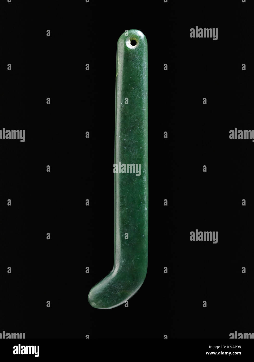 This curved ear ornament, known as a Kapeu, reflects indigenous ...