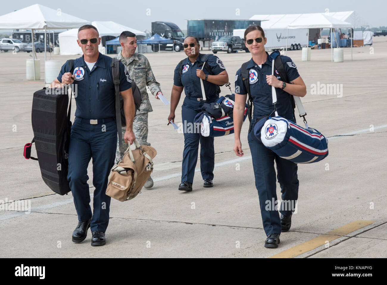 Members of the U.S. Air Force Thunderbirds walk towards building 1610 ...