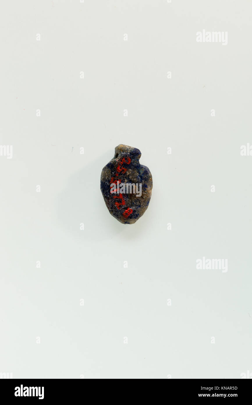 This heart-shaped amulet is an example of symbolic and artistic ...