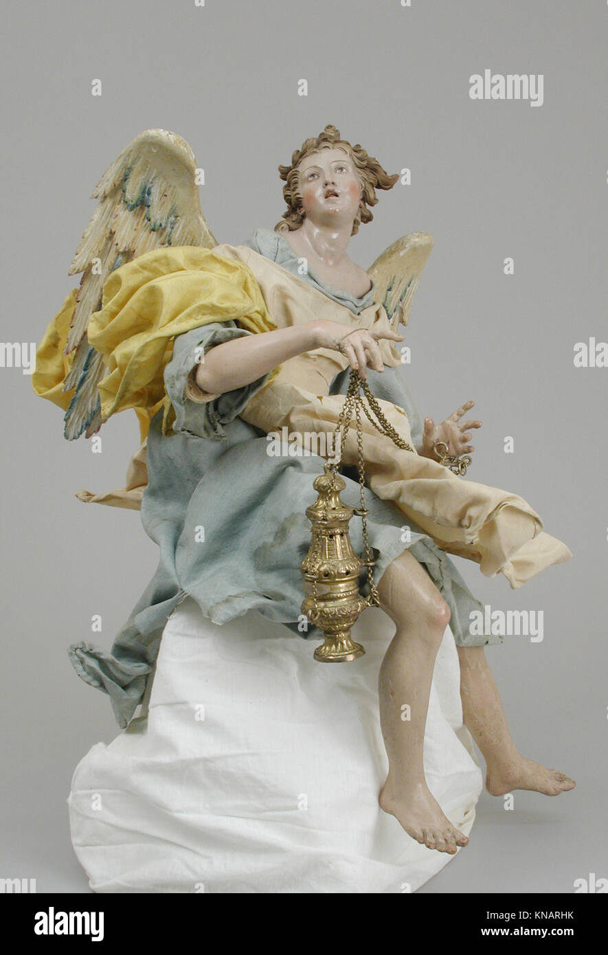 This angel sculpture exemplifies classical artistic representation ...