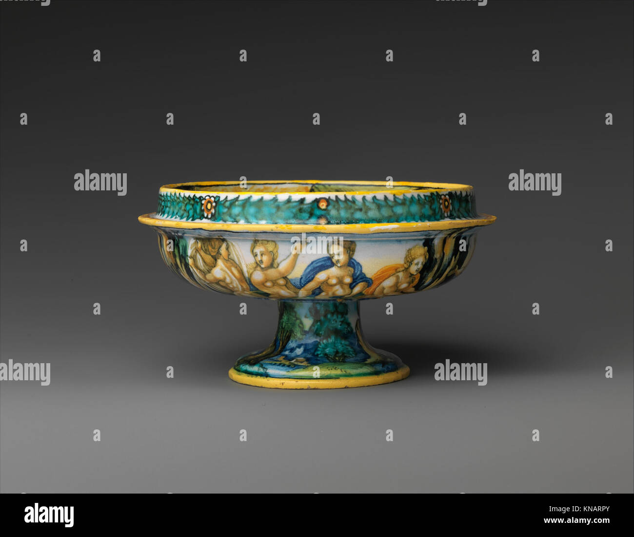 This bowl from a birth set depicts a birth scene along with the ...