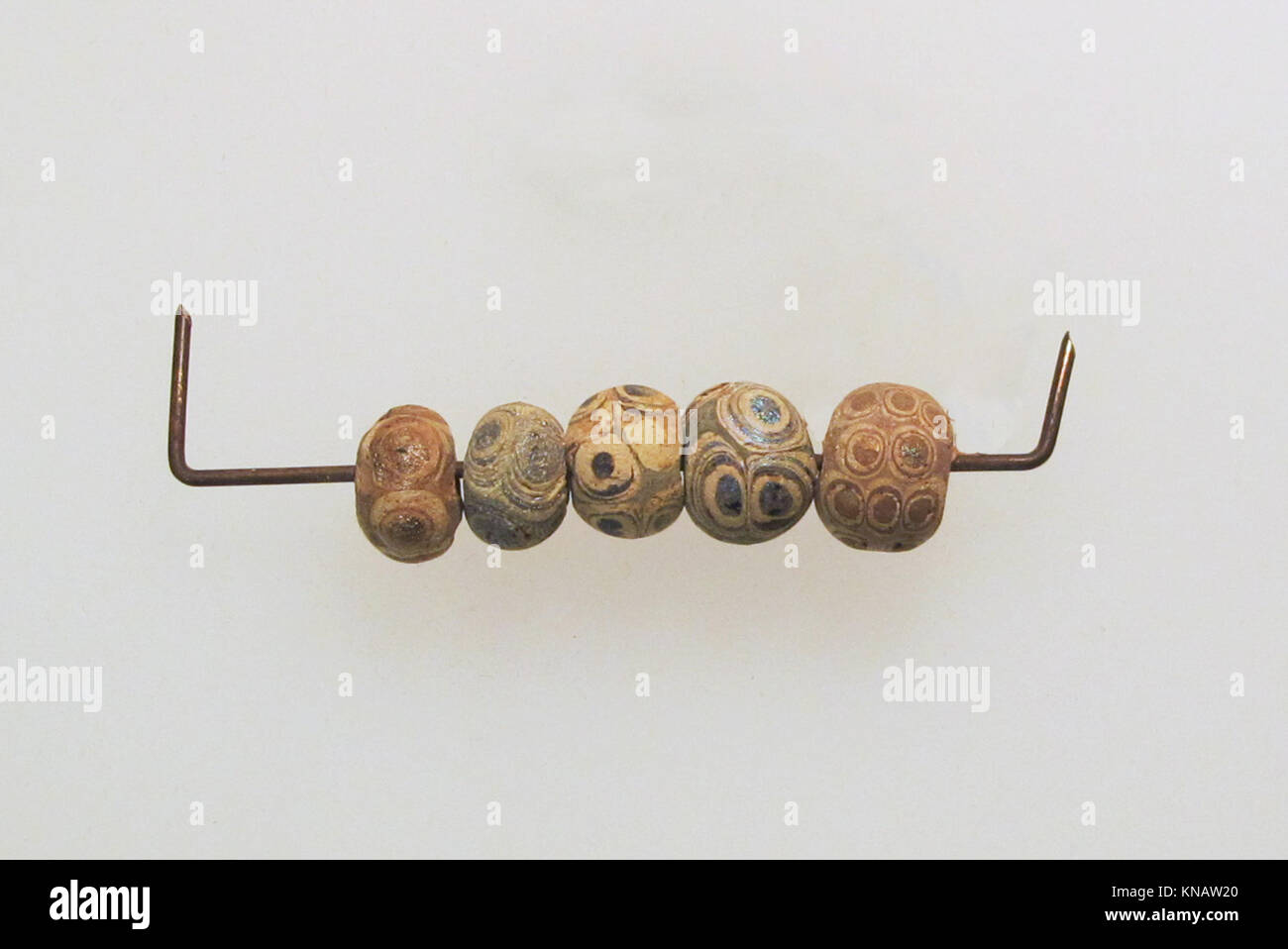 Collection of five beads showing varied colors and designs ...