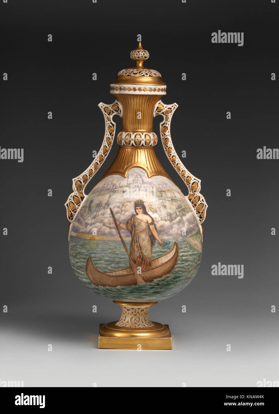This covered vase features intricate design elements and decorative ...