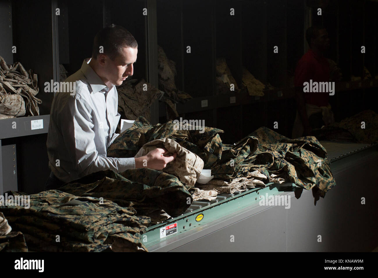 New recruits prepare uniforms to be handed out to other recruits in ...