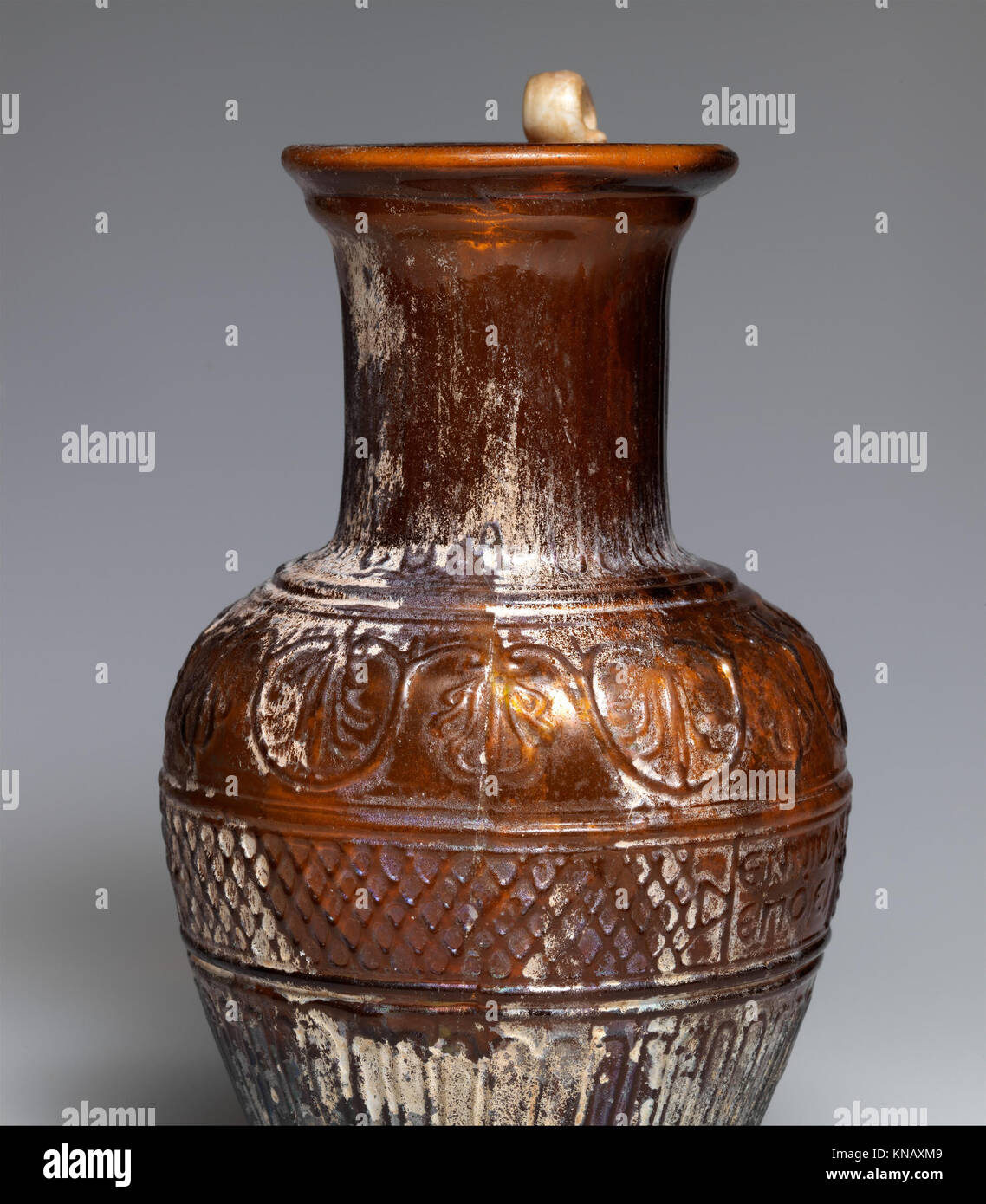 This glass jug features intricate craftsmanship and design, showcasing ...