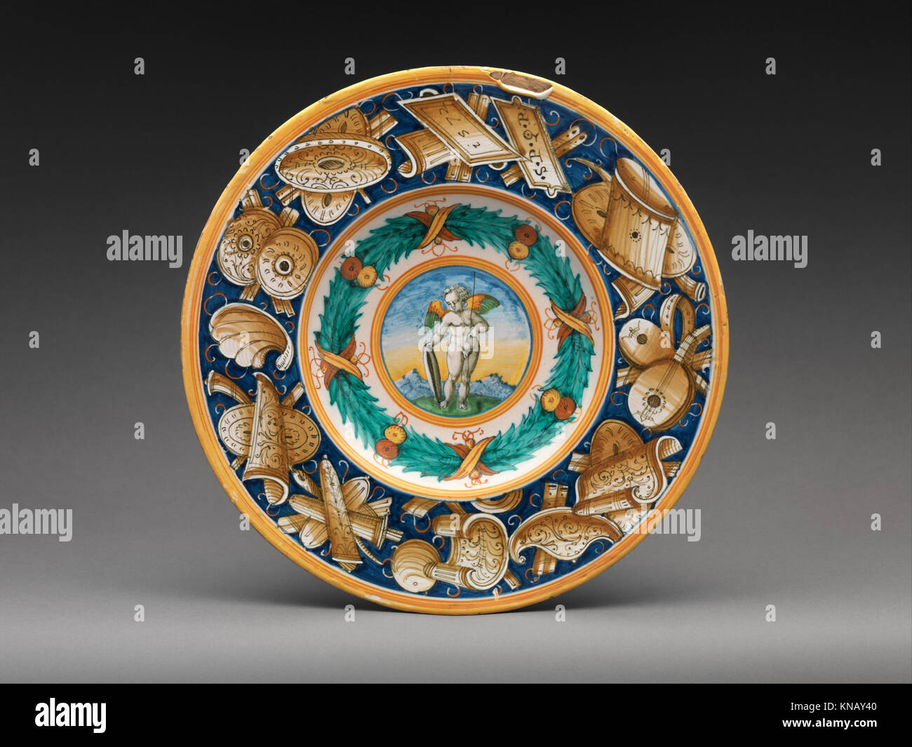 A dish featuring a winged putto, a small figure often seen in ...