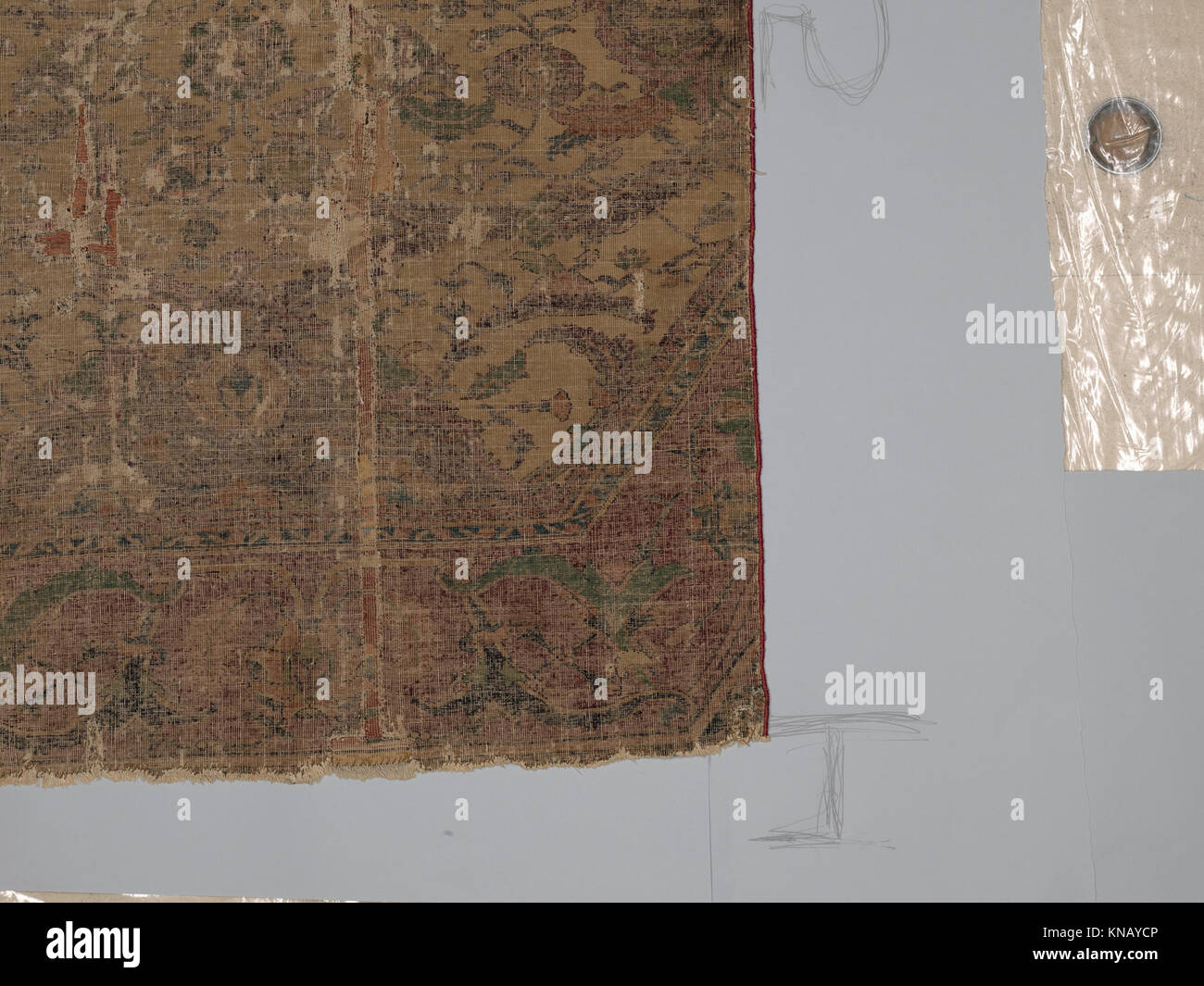 This carpet fragment showcases intricate patterns typical of the ...