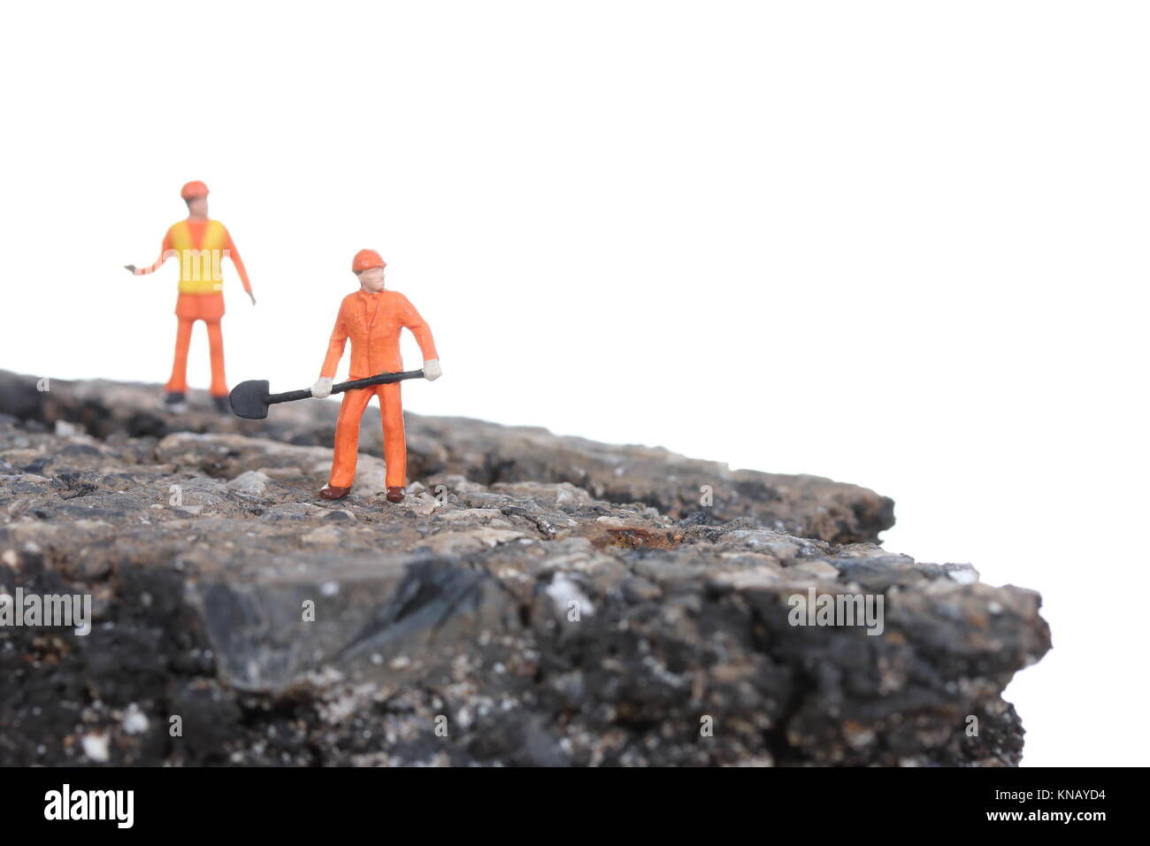 Miniature worker with a shovel Stock Photo - Alamy