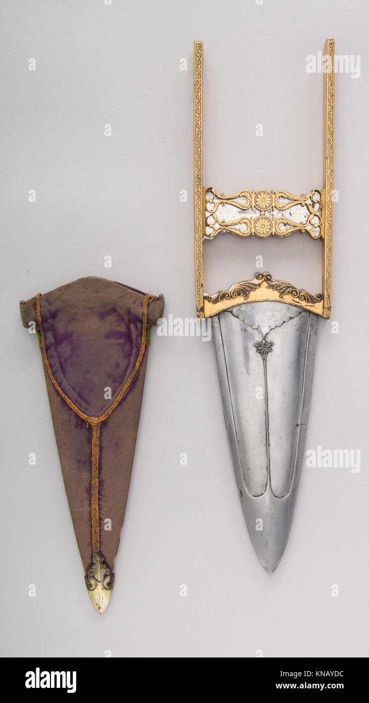 This dagger, or katar, includes both sheath and blade, designed for ...