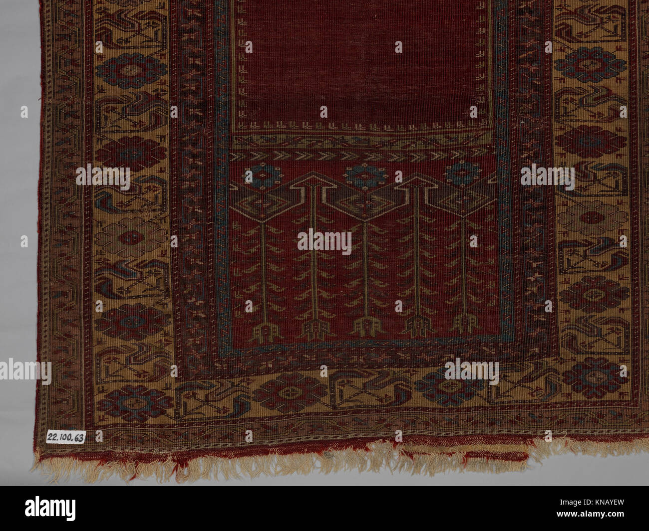This carpet from the MET collection features intricate weaving patterns ...