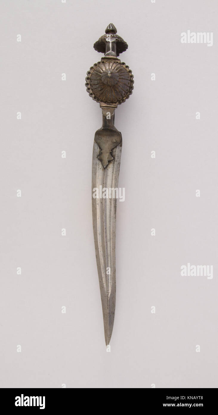 This dagger, known as a Bichuwa, showcases the intricate blade design ...