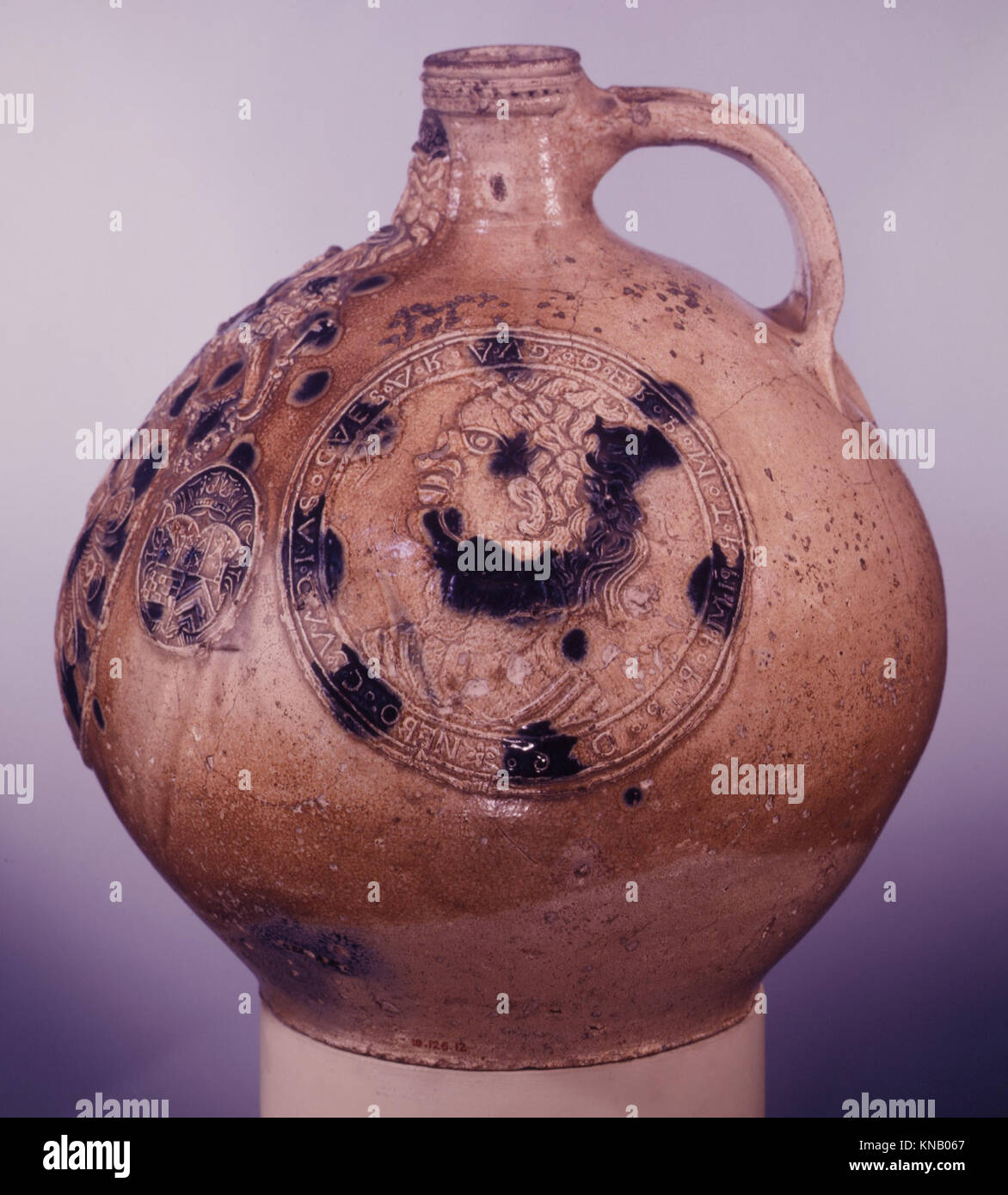 This bottle jug features a functional yet decorative design. It is ...