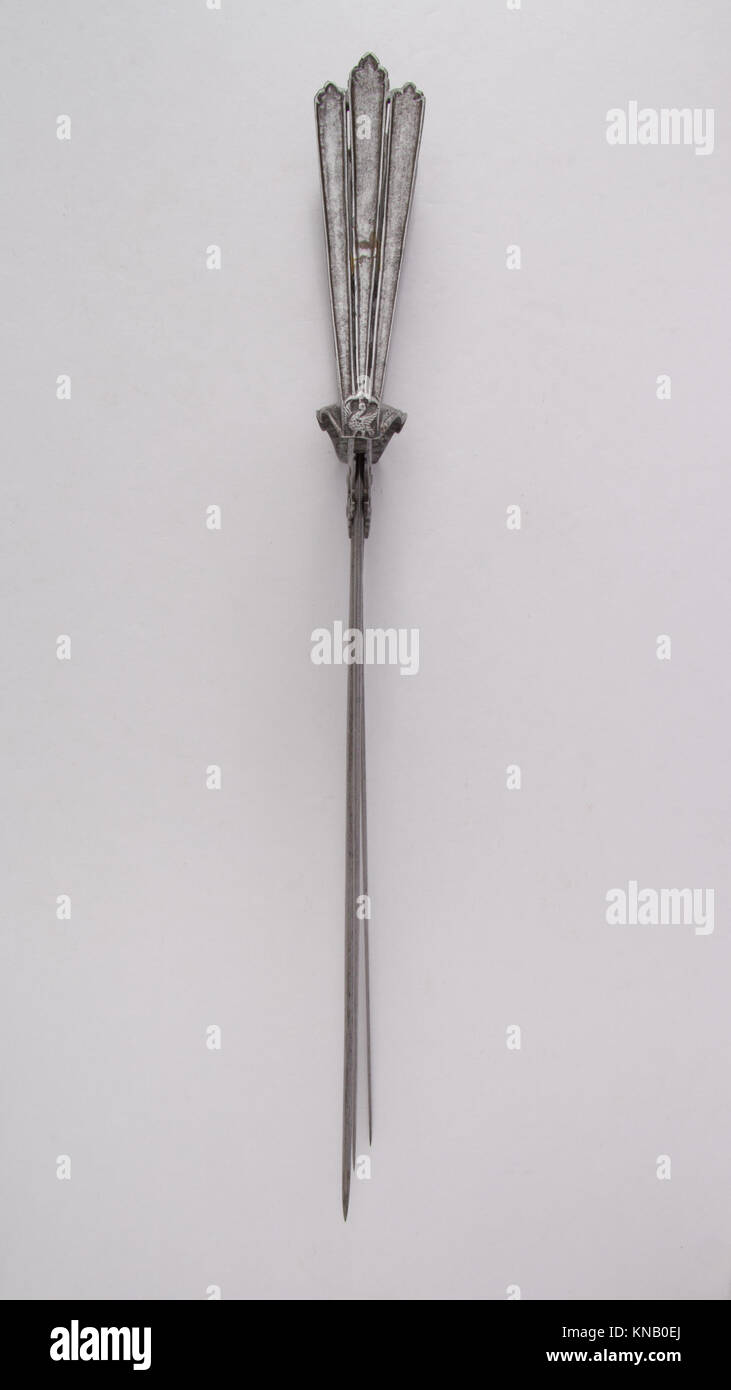 This Katar dagger, known for its distinctive triangular blade, is a ...