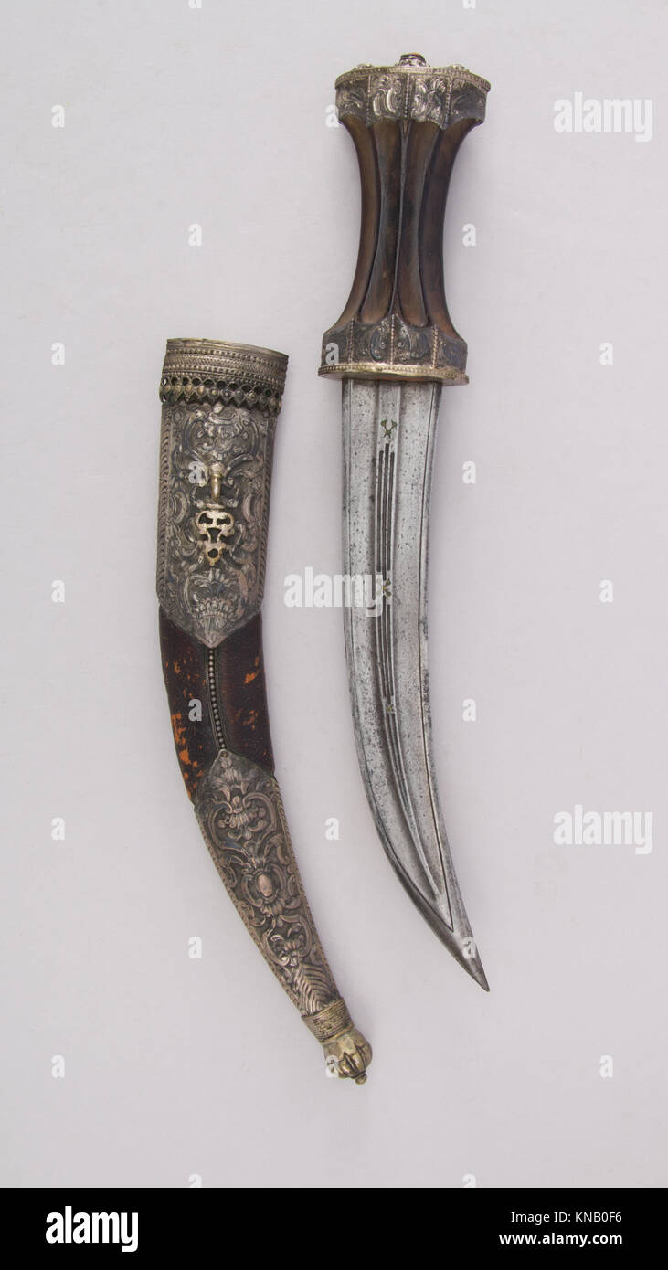 A Jambiya dagger with a sheath, showcasing the fine craftsmanship of ...