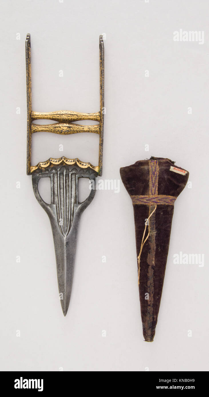 This katar, a traditional Indian dagger, is accompanied by its sheath ...