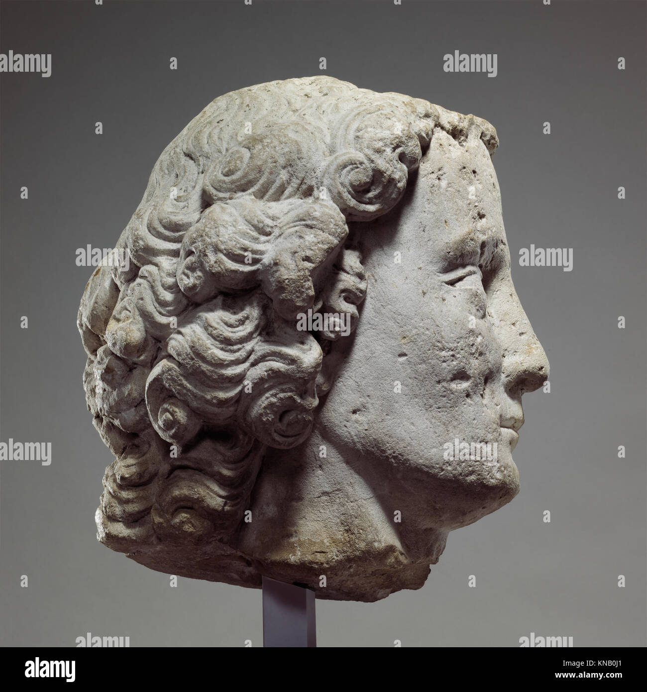 This marble sculpture depicts the head of an angel, a representation of ...