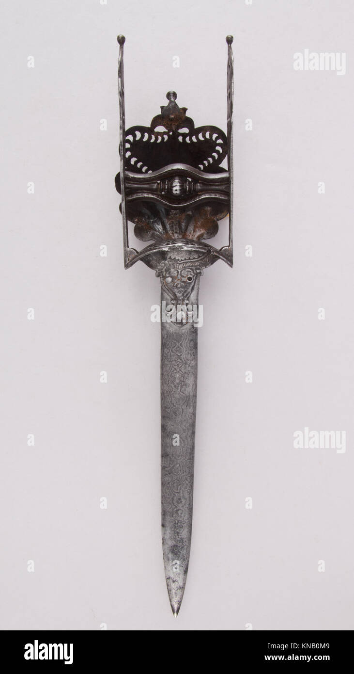 This katar is a traditional Indian weapon with a distinctive H-shaped ...