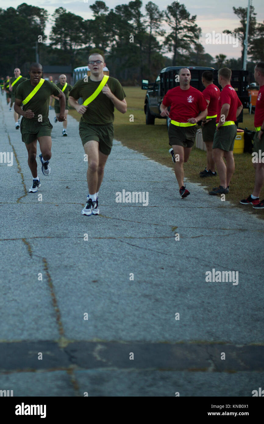 New recruits finish a 1.5-mile run during an initial strength test in ...