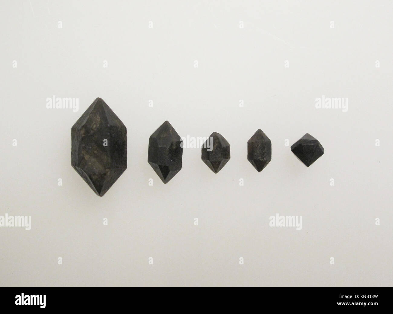 This collection of five quartz crystals highlights the natural beauty ...