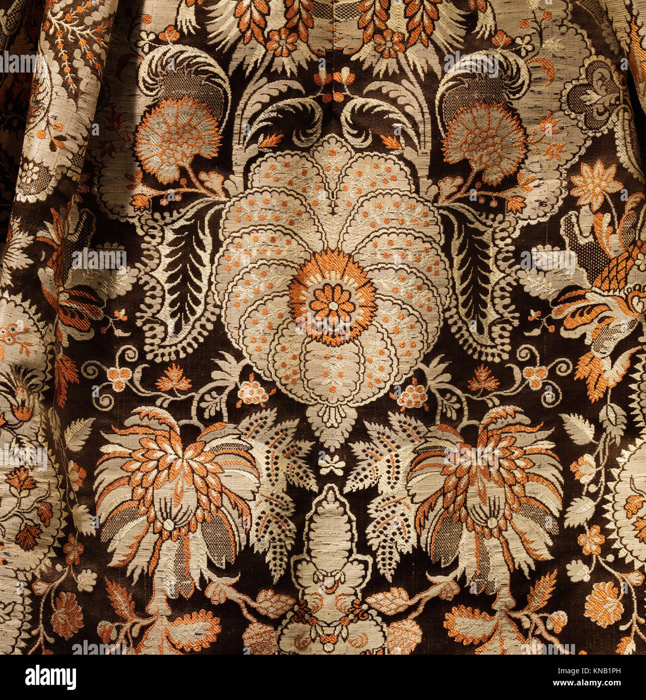 This dress, showcased in a historical collection, represents the ...