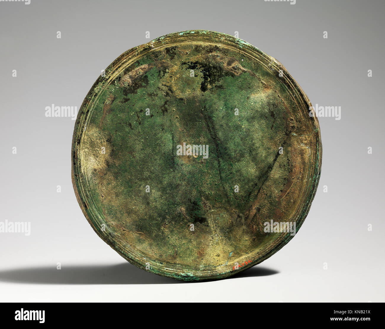 This bronze mirror cover is a historical artifact from the MET ...