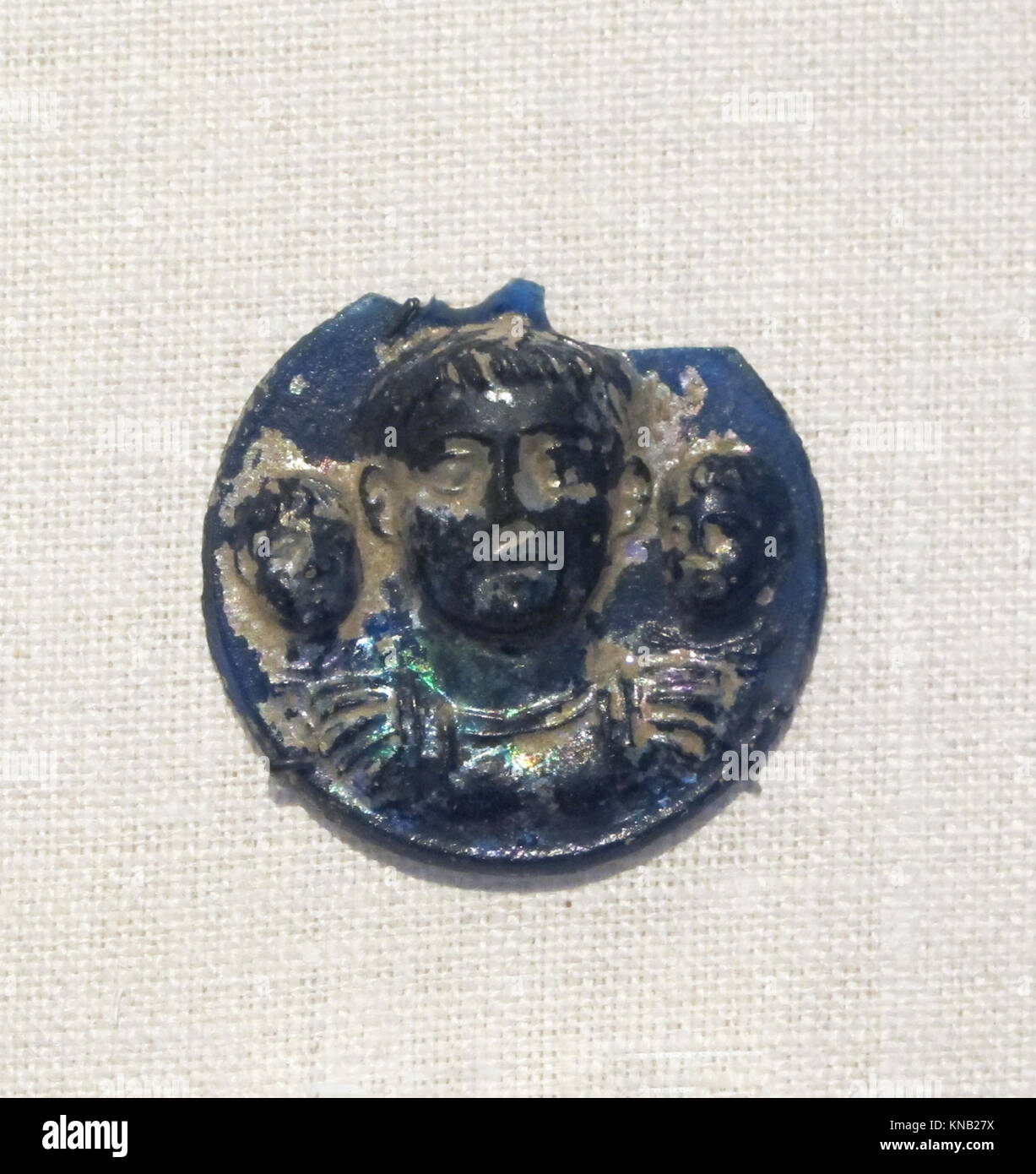 This glass phalera shows Roman imperial portraits, reflecting detailed ...