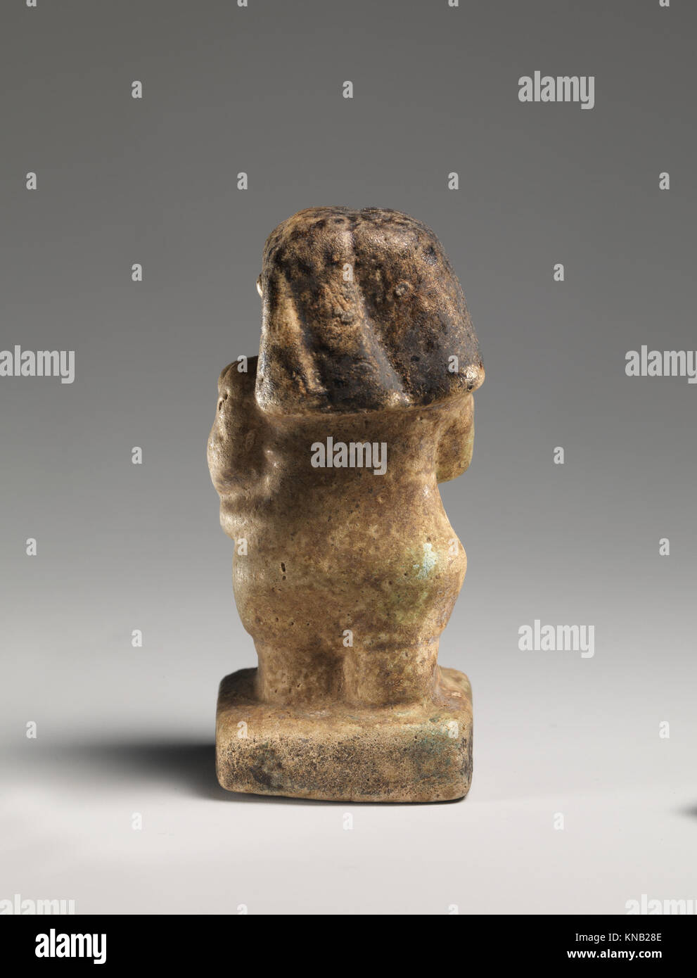This figurine depicts a woman with her baby, representing maternal care ...