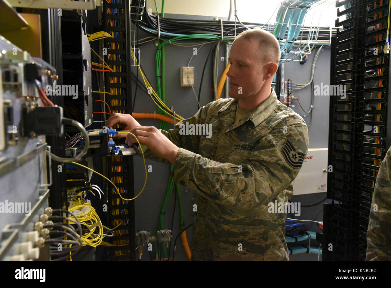 Tech. Sgt. Garrett Havens, of the 119th Communications Flight, works on ...