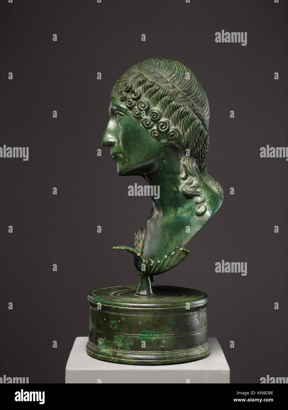 This bronze portrait bust depicts a Roman matron, highlighting Roman ...