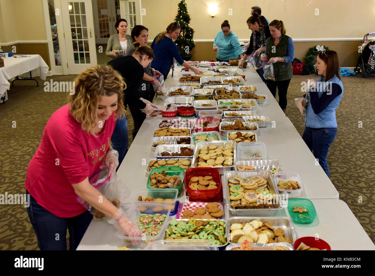 Members of Team Seymour pack donated cookies during the annual Officer ...