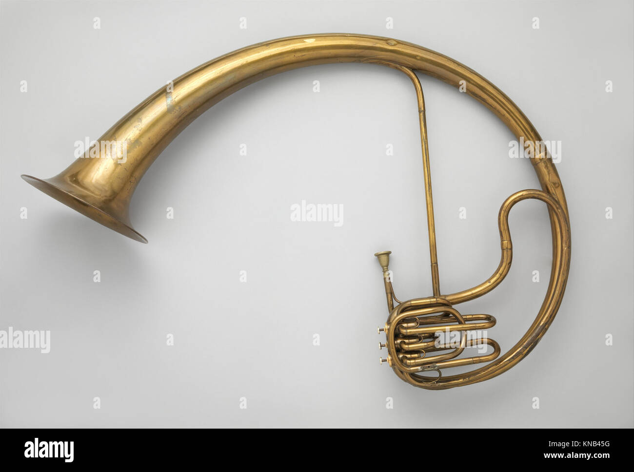 This E-flat bass saxtuba is a brass musical instrument with a large ...