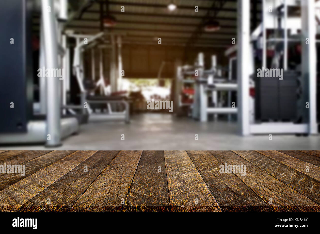 Wooden table on blurred background of fitness gym interior of modern ...