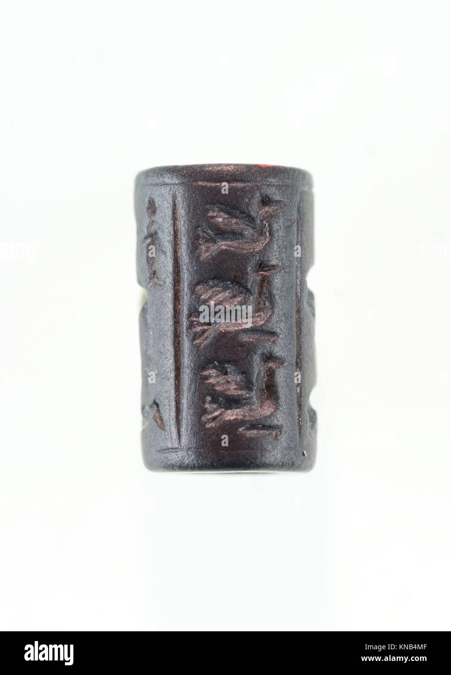 This cylinder seal features intricate engraving, reflecting the ...