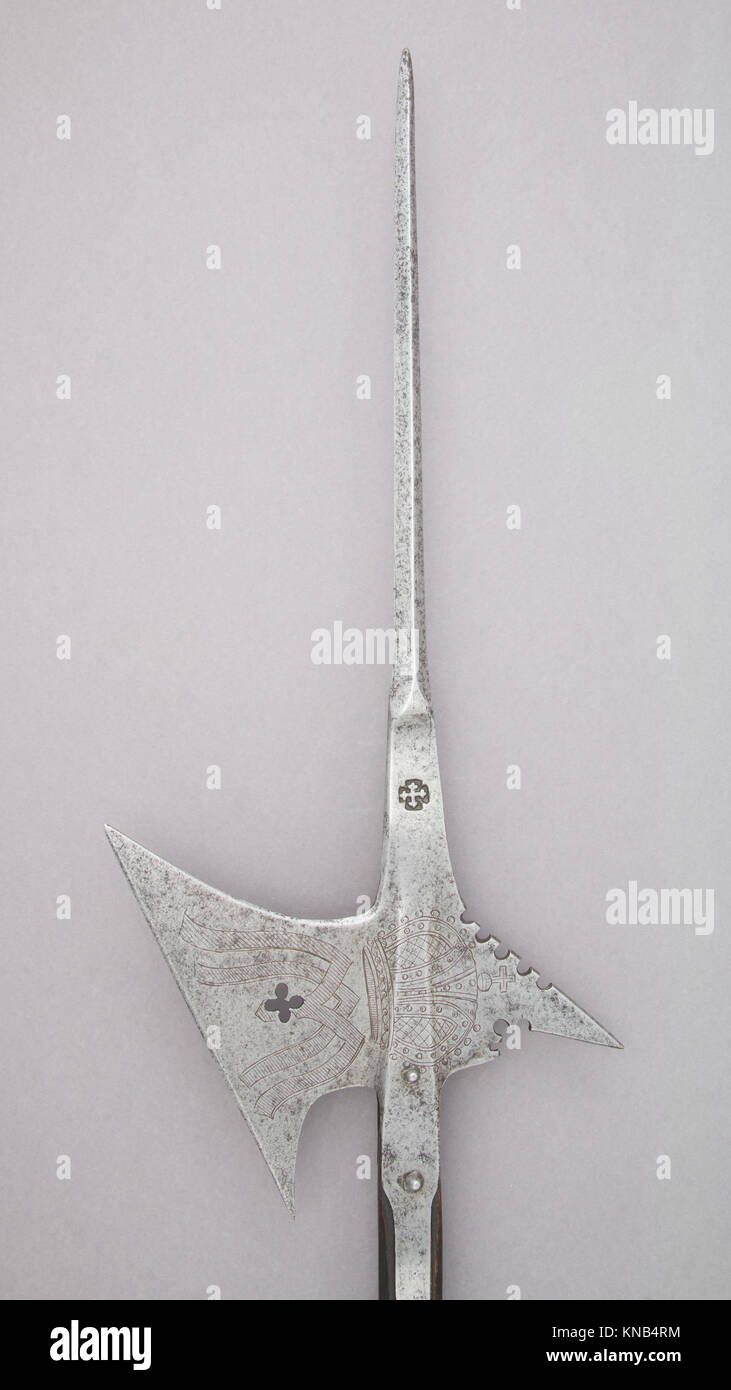 This halberd, a medieval pole weapon, features a combination of spear ...