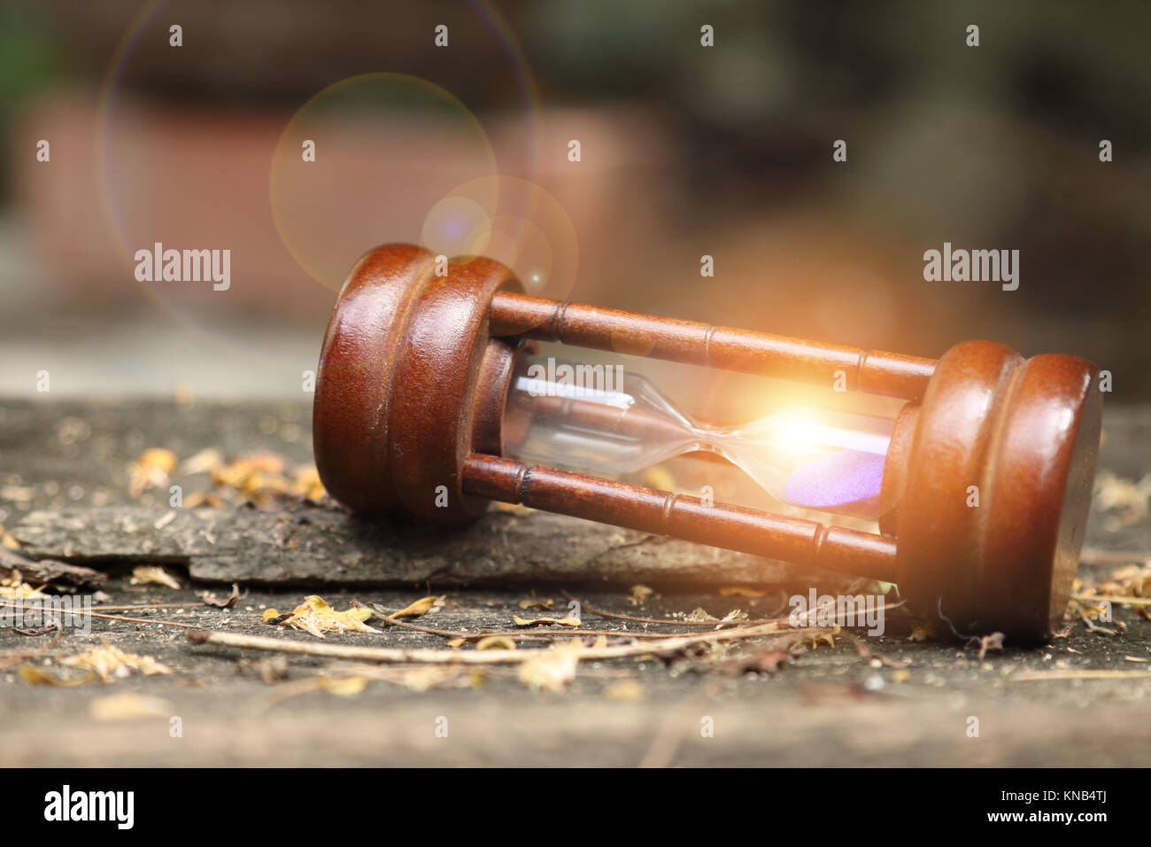 Sand clock on wood table Stock Photo - Alamy