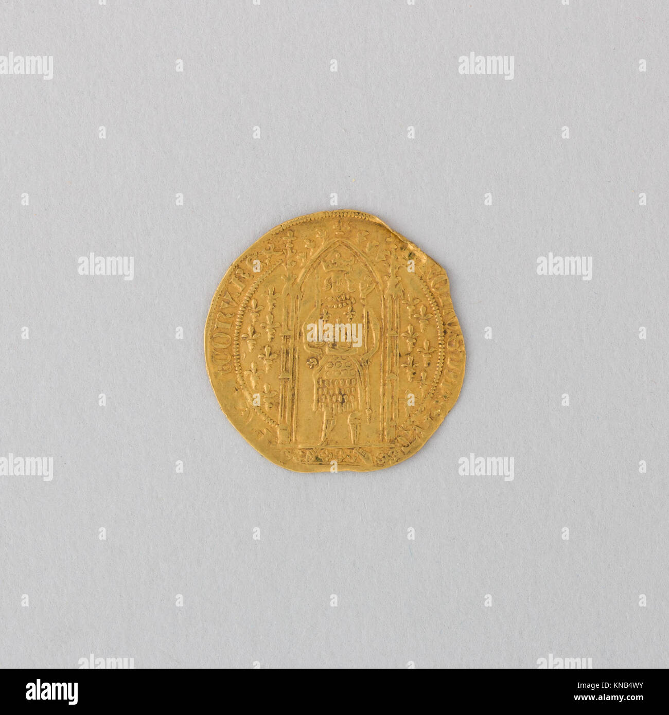 This coin, minted during the reign of Charles V, depicts the monarch's ...