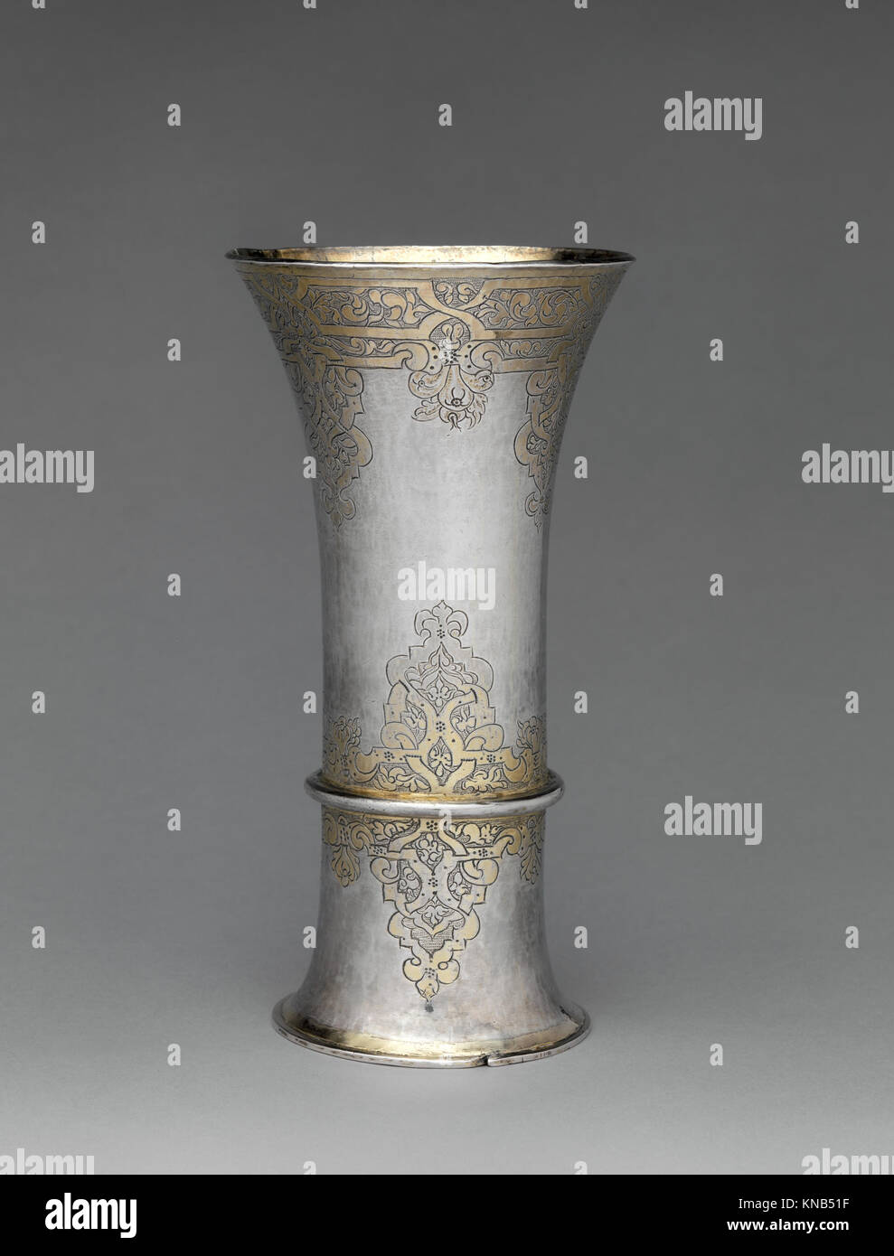This footed beaker, made of glass or metal, illustrates 16th-17th ...