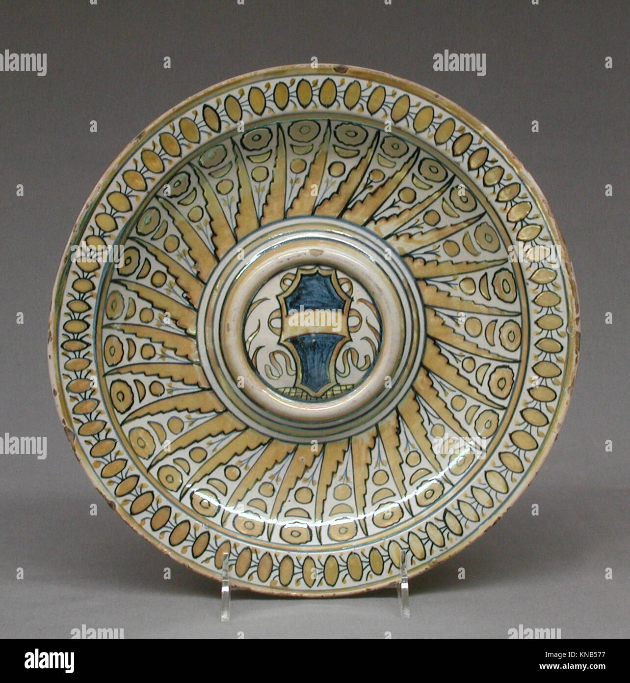 A decorative dish featuring intricate design elements, housed in the ...