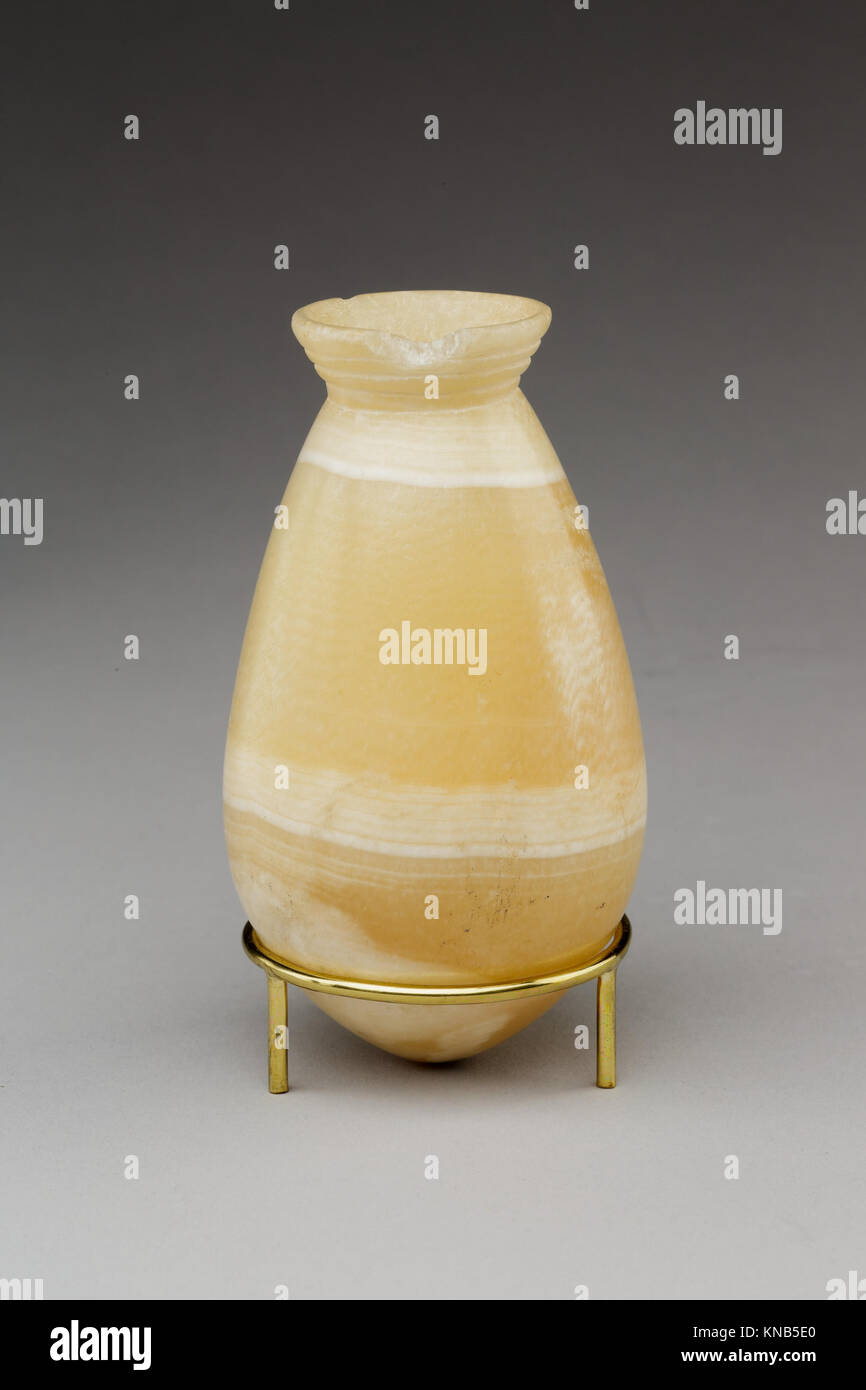 This bag-shaped jar features a ridged neck, showcasing ancient ceramic ...