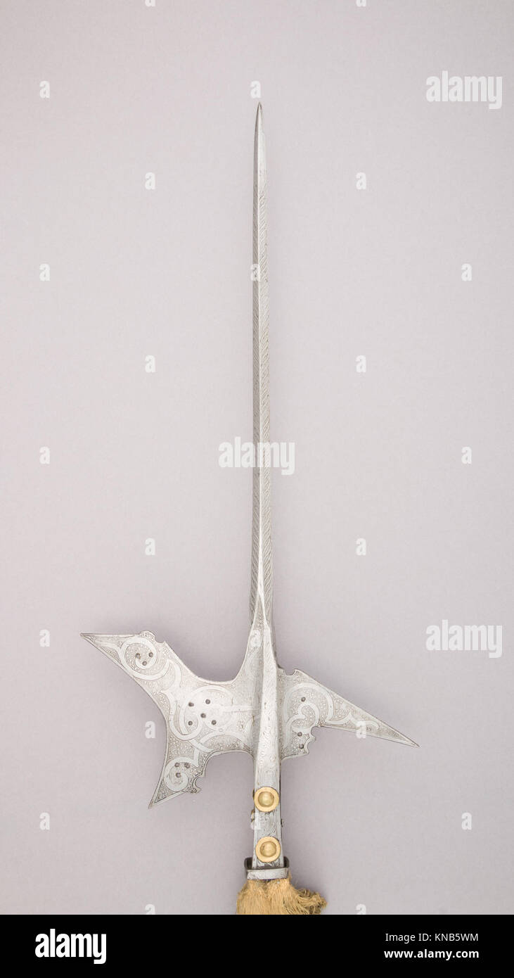 This halberd, dating from the early 16th century, features a broad, axe ...