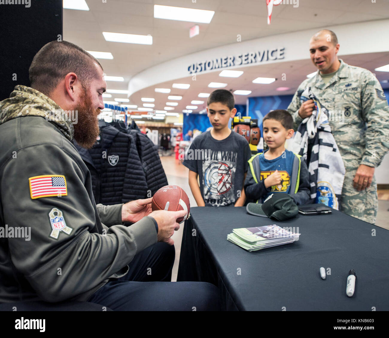 Oakland Raiders tight end Lee Smith signs an autograph for U.S. Air ...
