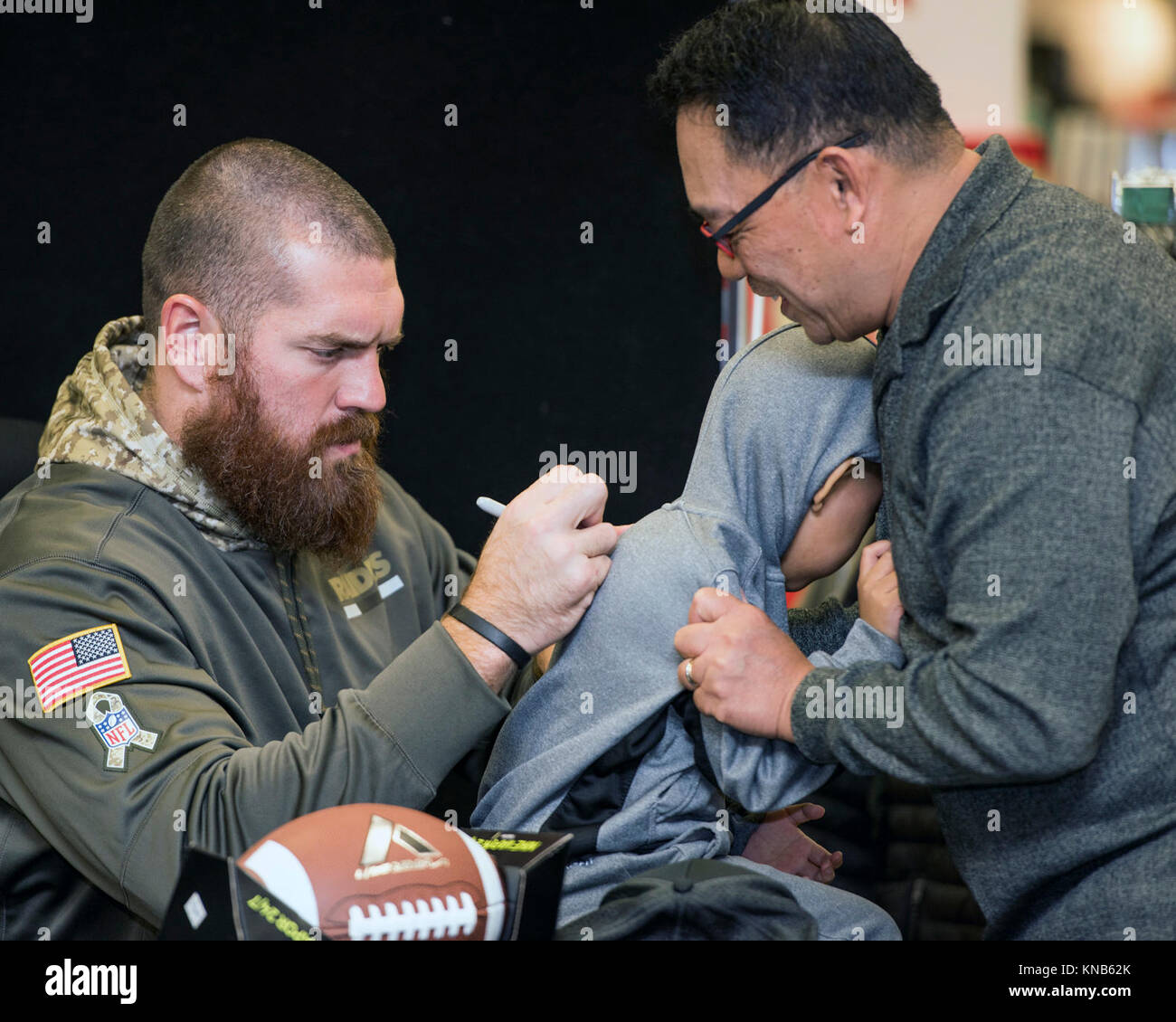 Oakland Raiders tight end Lee Smith signs an autograph for a fan during ...