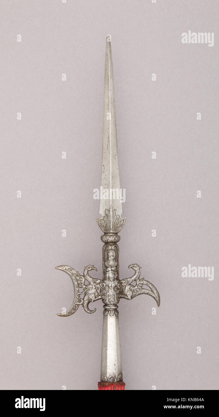 This halberd is a medieval weapon combining a spear and axe, typically ...