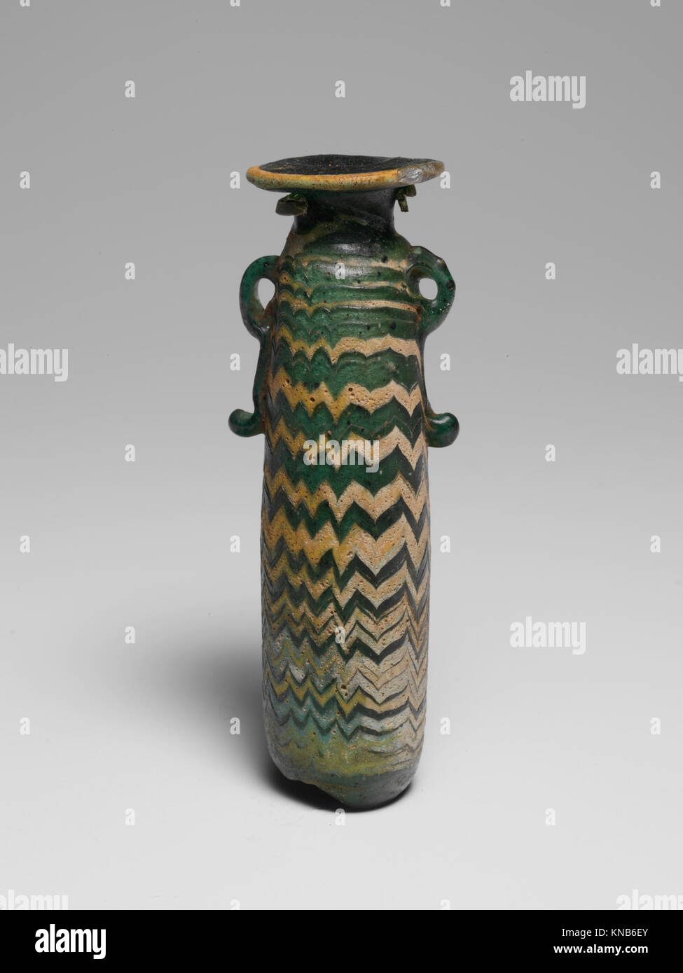 This glass alabastron, or perfume bottle, represents a delicate example ...