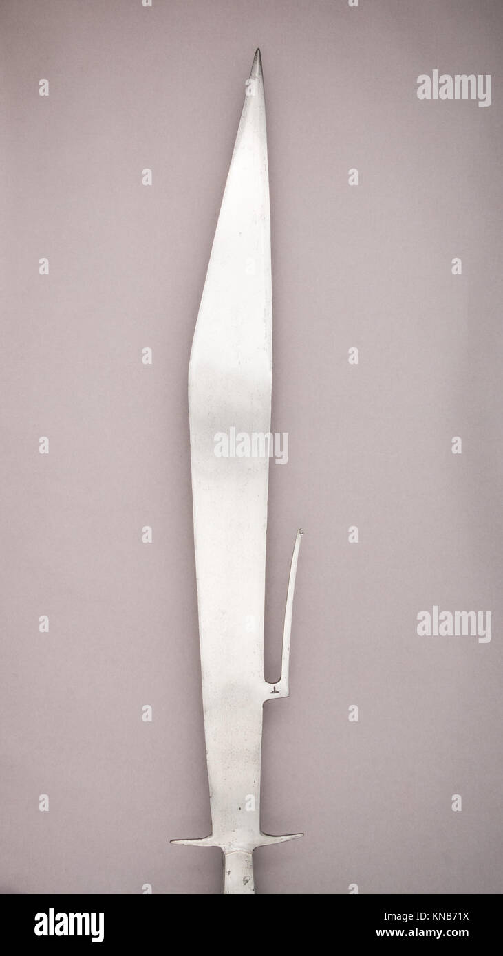 This glaive, a traditional polearm weapon, features sharp edges and a ...