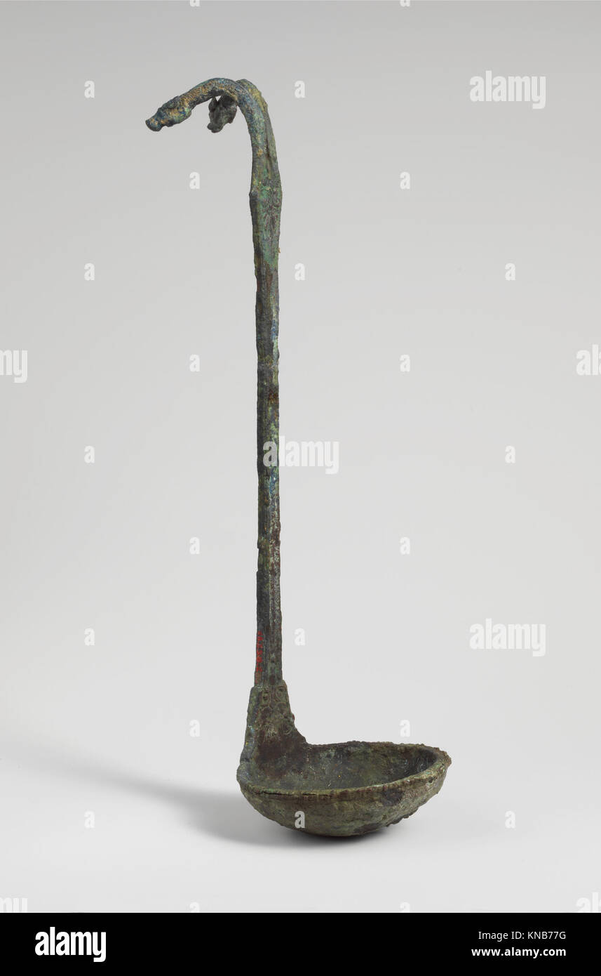 This bronze kyathos, a type of ladle, is adorned with animal-head ...
