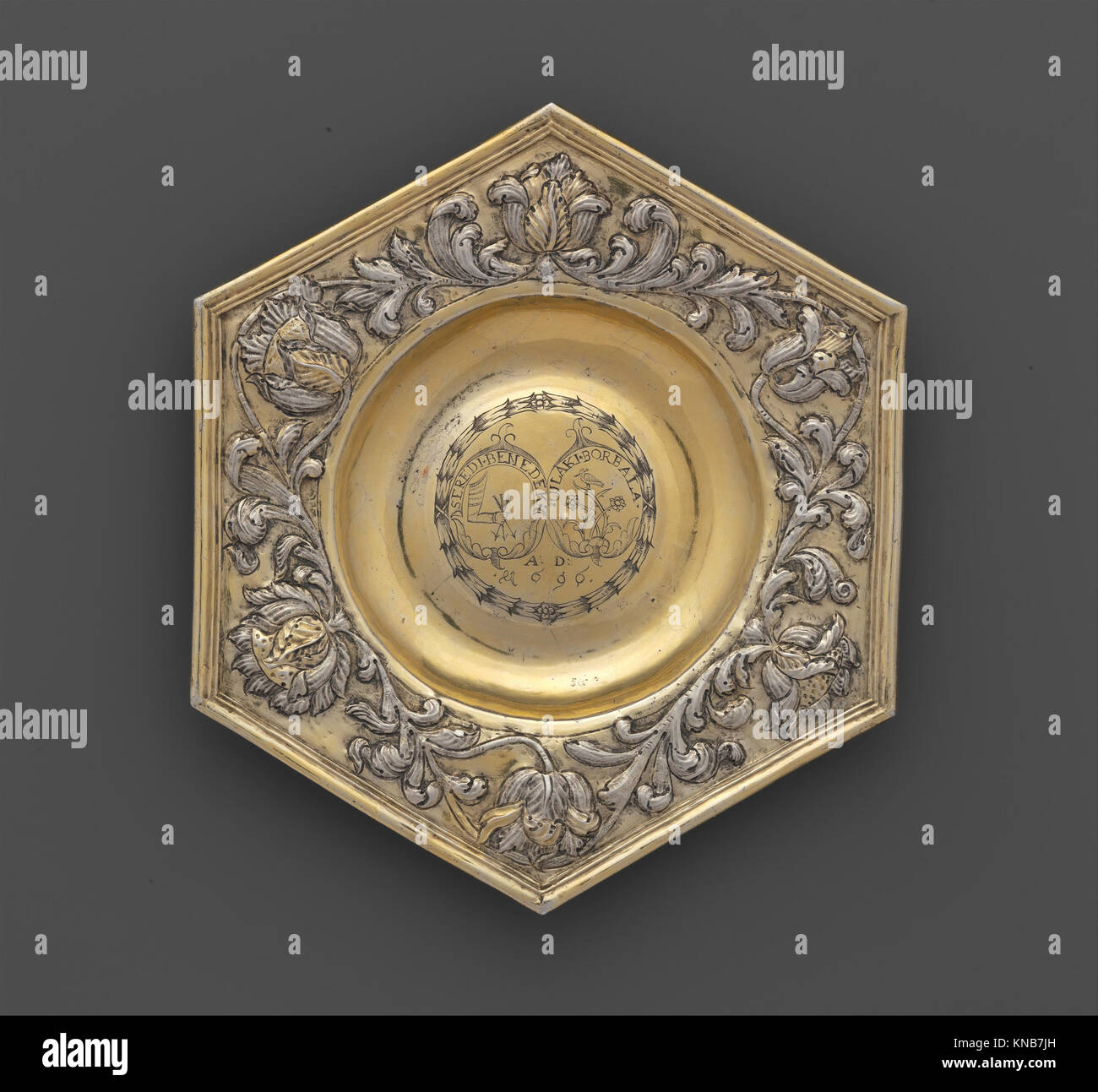 This hexagonal dish, crafted with precision, displays elegant detailing ...